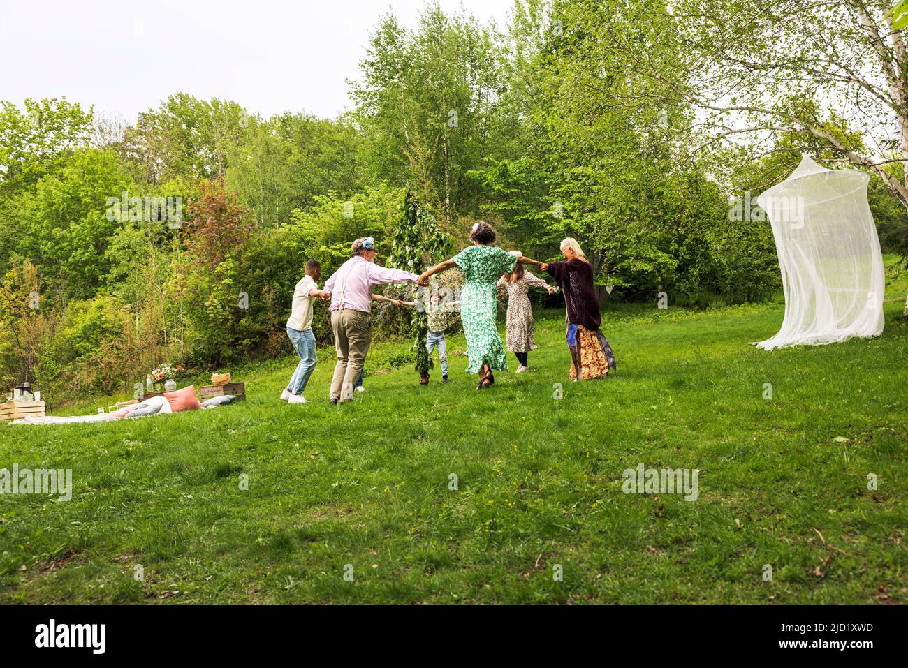 People dancing around midsummer maypole Stock Photo - Alamy