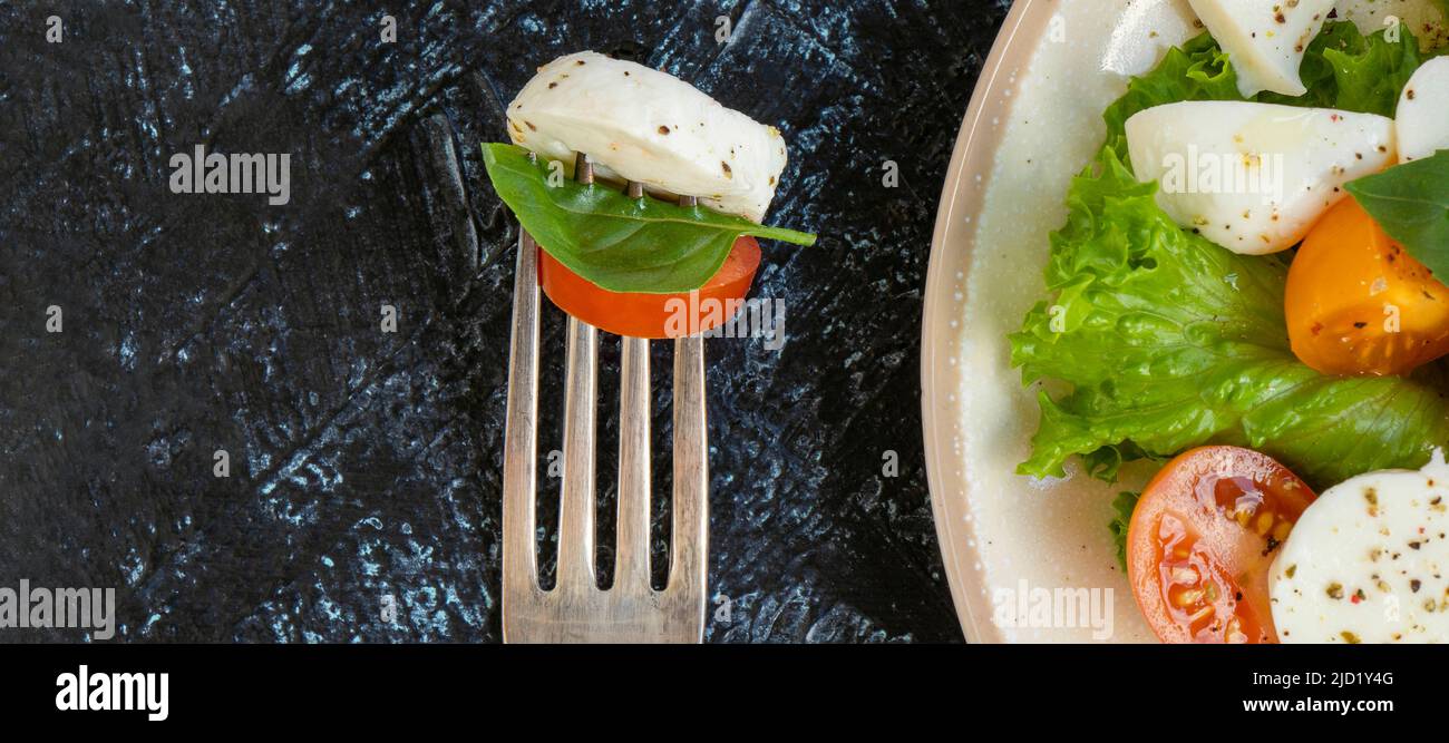 banner with Caprese salad with tomatoes, mozzarella, basil and olive ...