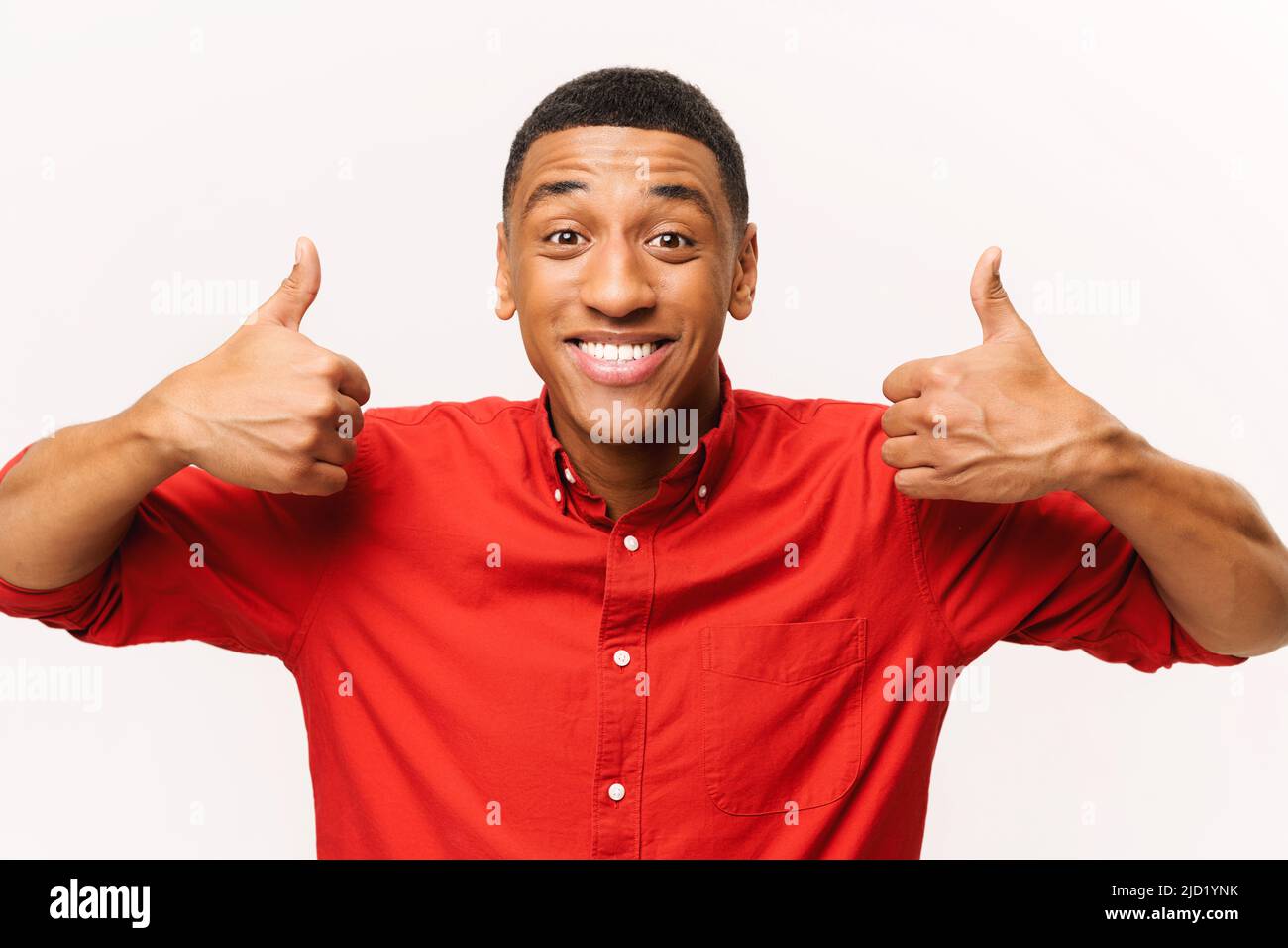 Like, excellent job. Pleased man smiling to camera and gesturing thumbs ...