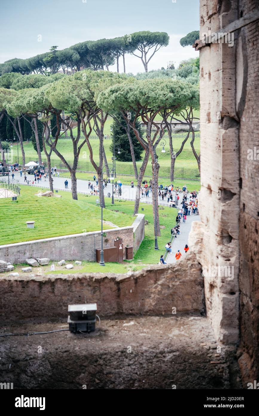 Scenic view of the busy street with green trees and ancient ruins in ...