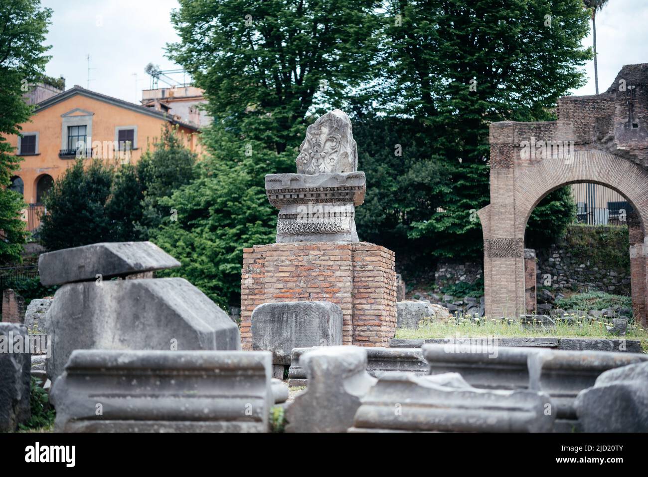 Scenic view of the busy street with green trees and ancient ruins in ...