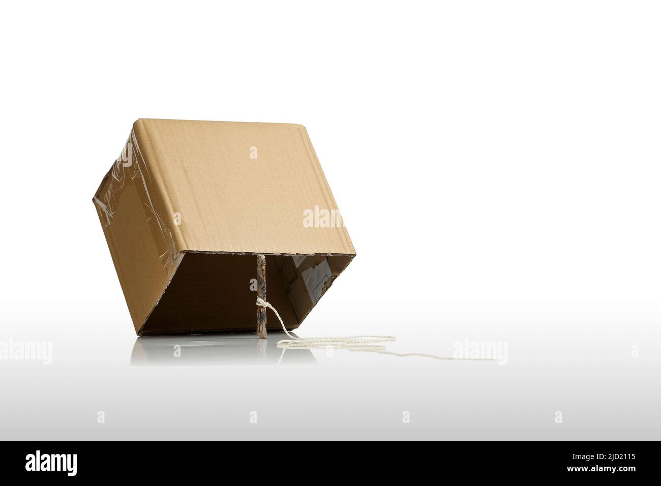 cardboard box with stick as trap isolated on white with copy space ...