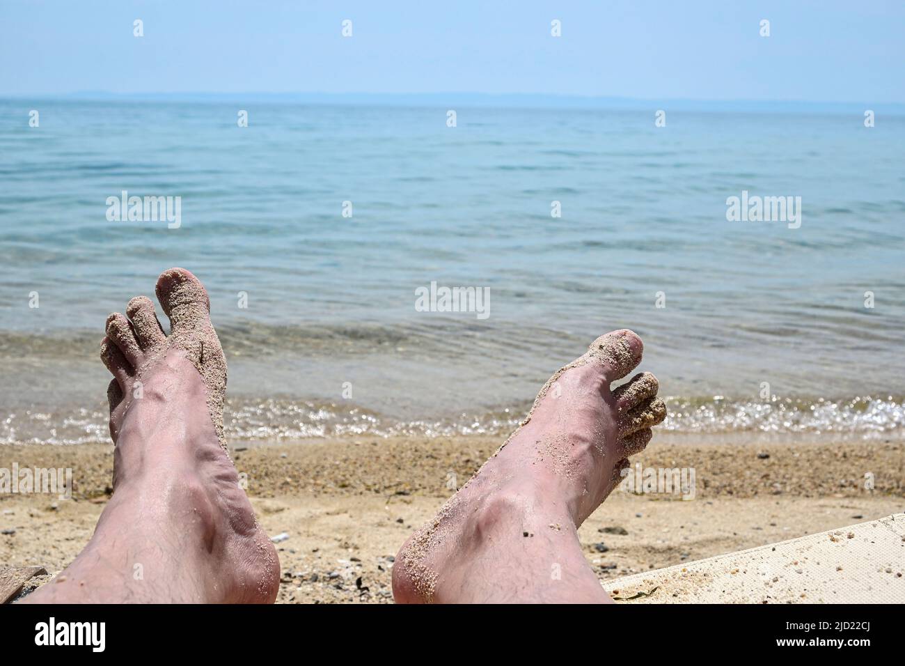 Mans feet at beach hi-res stock photography and images - Alamy