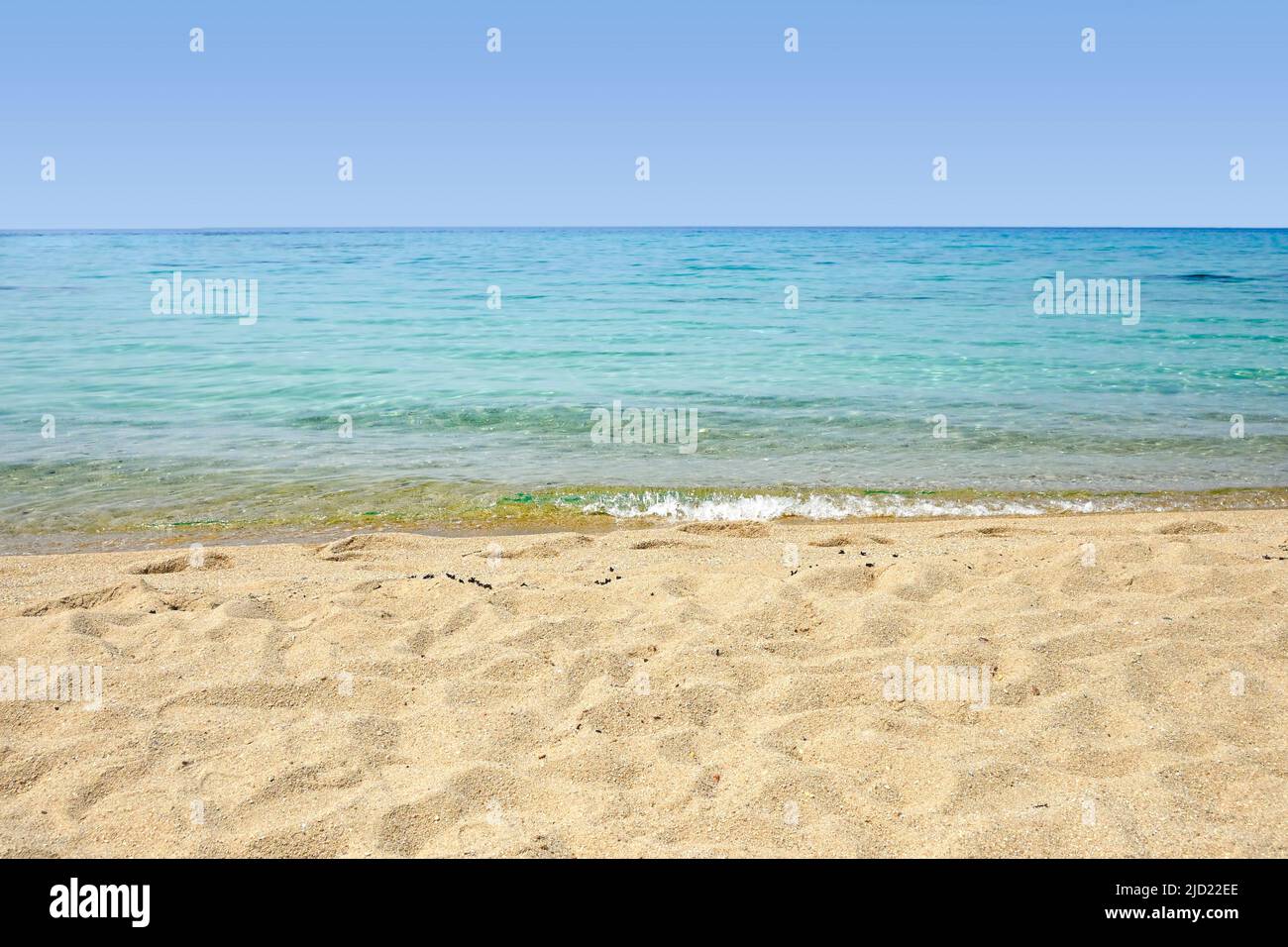 beautiful empty beach with blue calm sea and sky Stock Photo - Alamy