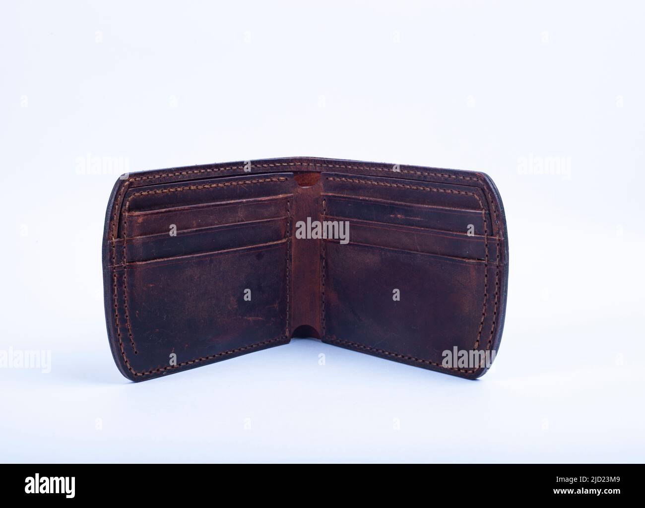 leather wallet with banknotes and credit card inside isolated on white ...