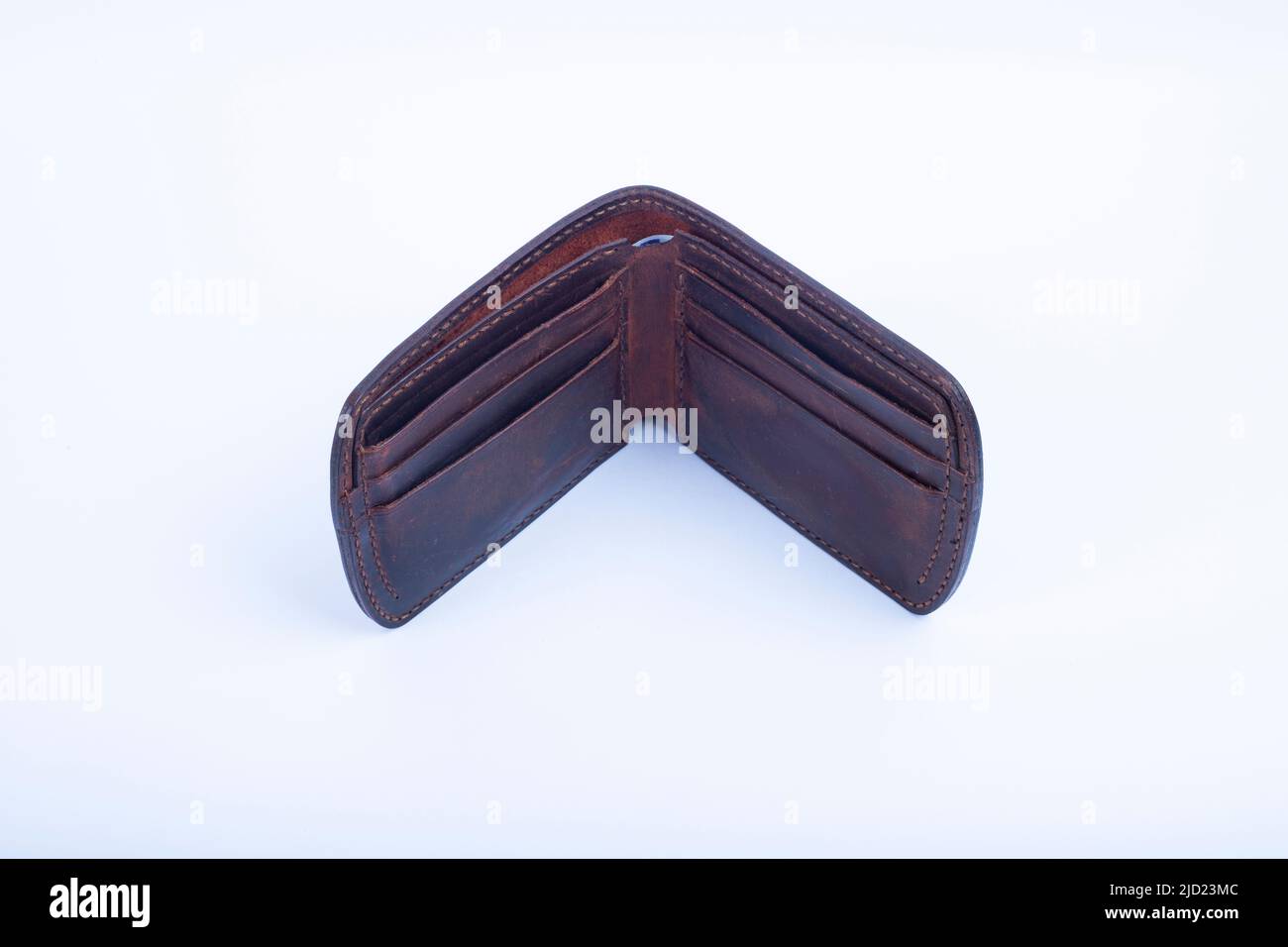 leather wallet with banknotes and credit card inside isolated on white ...