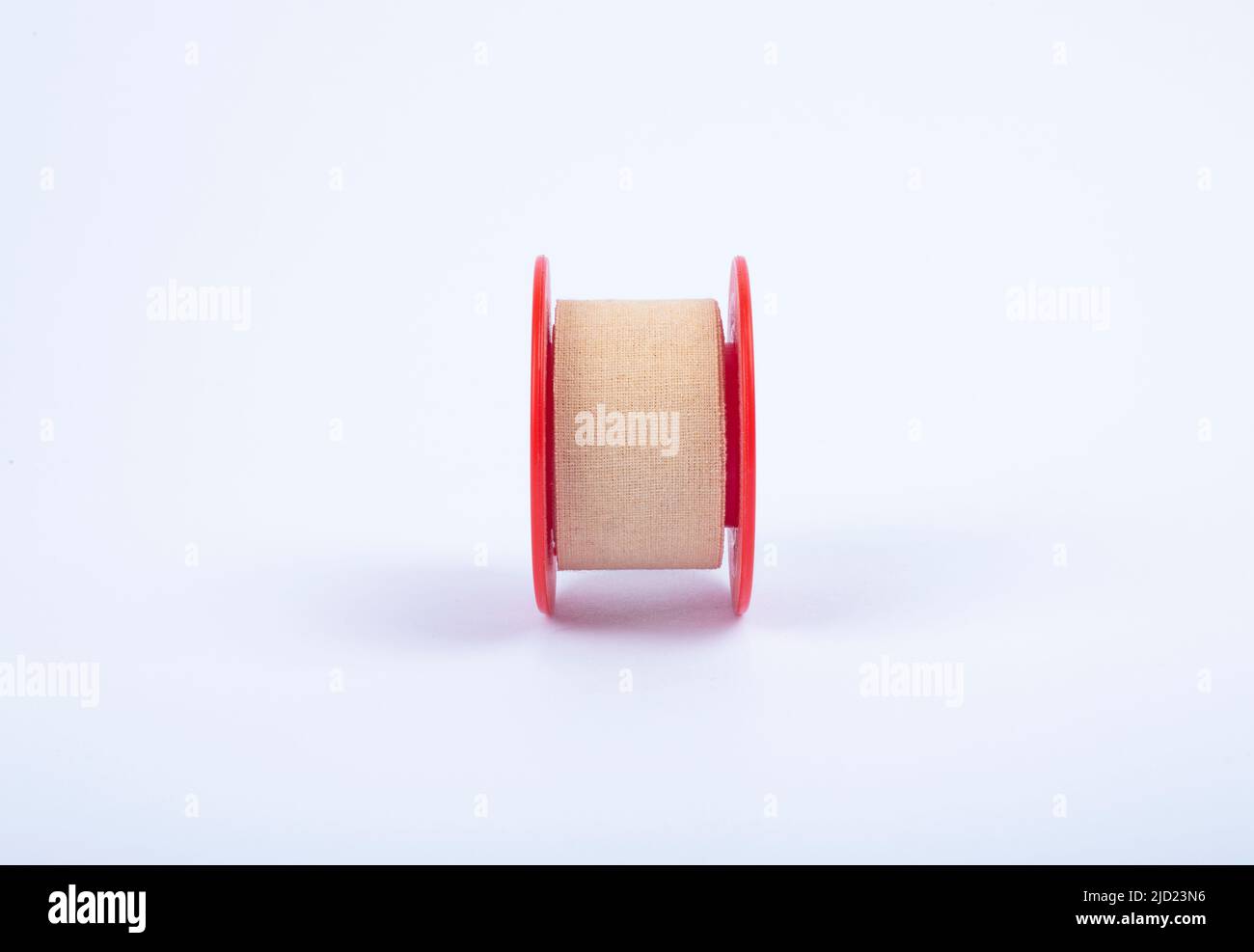 a plaster cross isolated over a white background Stock Photo - Alamy