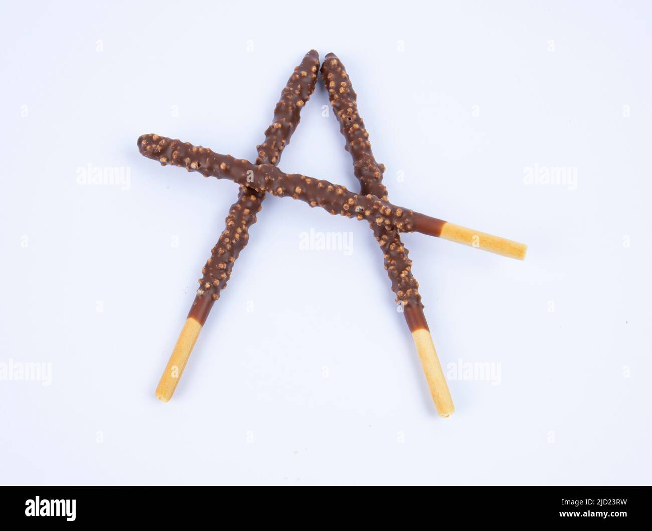 Chocolate covered cracker stick on a white background Stock Photo - Alamy