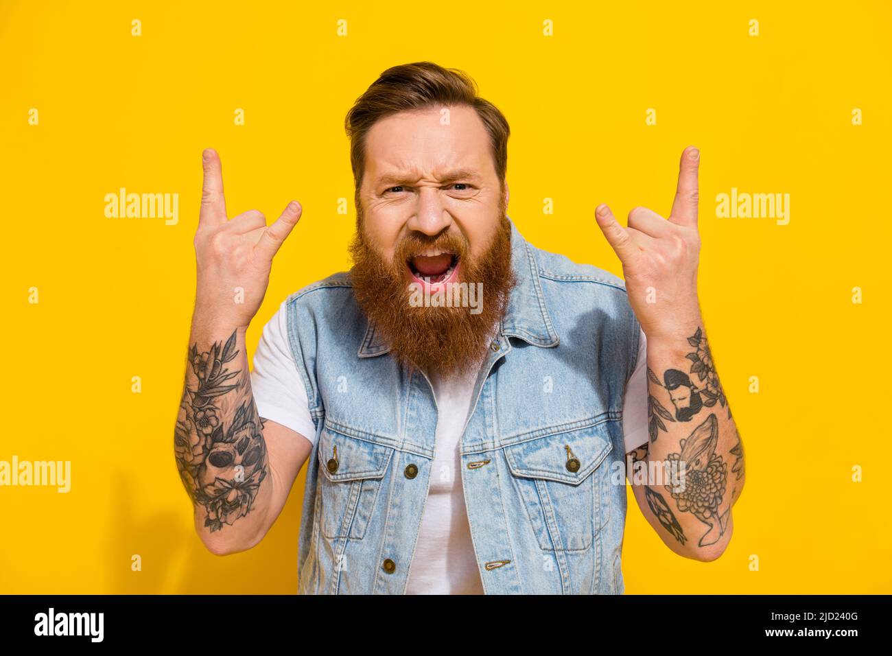 Portrait of carefree masculine person hands fingers show heavy metal ...