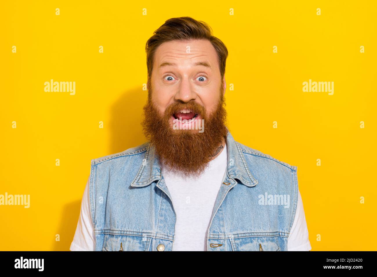 Photo of excited funny guy dressed denim vest smiling open mouth ...