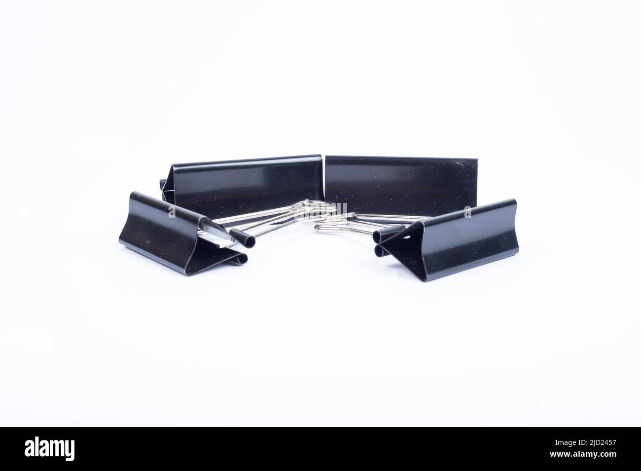 An image of black paper clips on white Stock Photo - Alamy