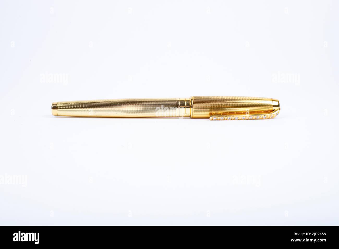 golden pen isolated on white background Stock Photo - Alamy