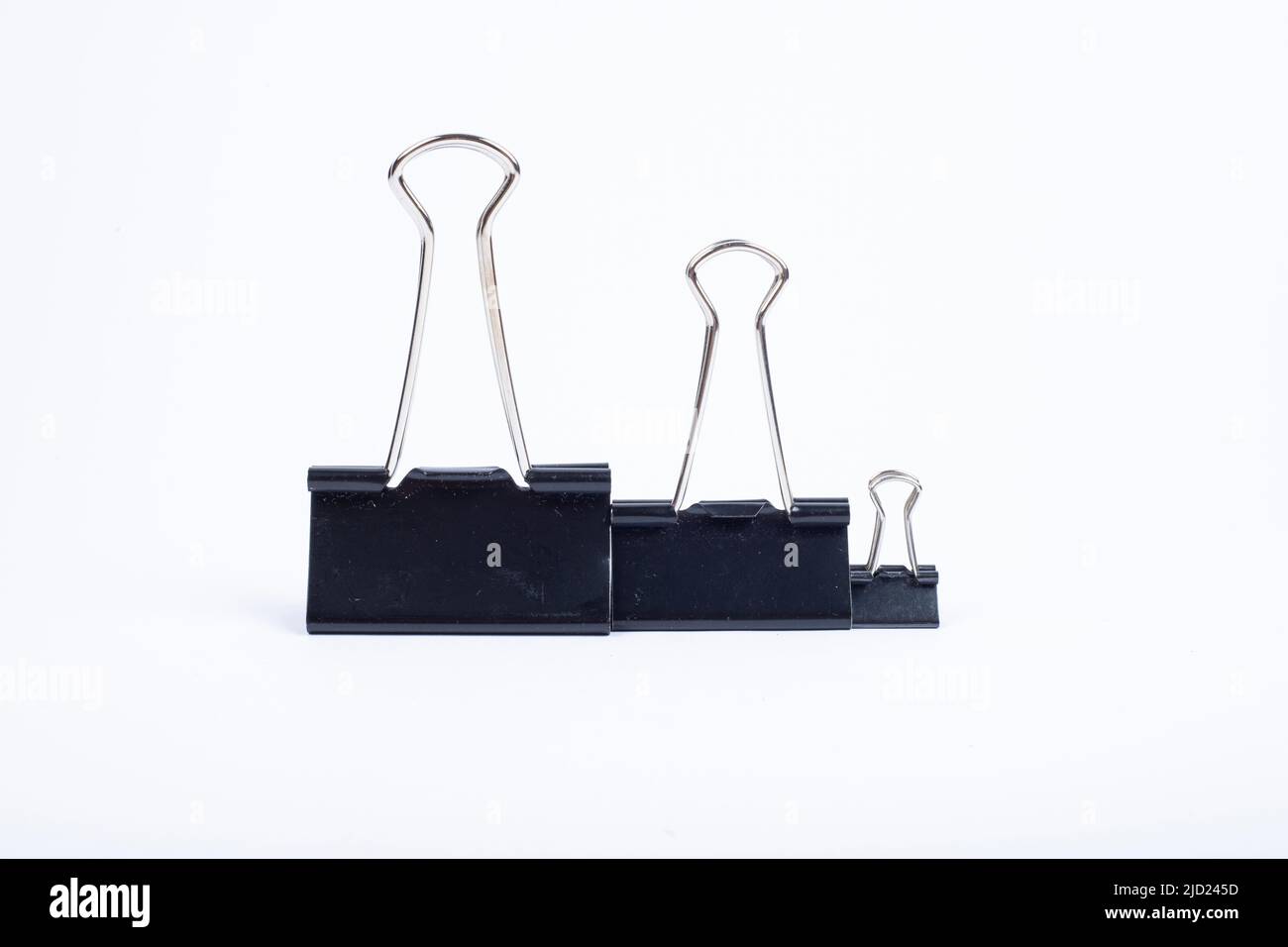 An image of black paper clips on white Stock Photo - Alamy
