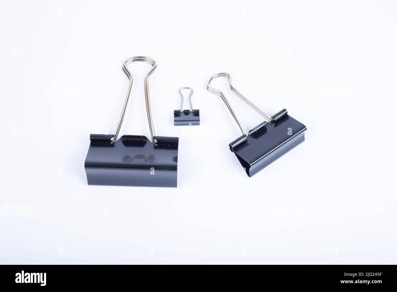 An image of black paper clips on white Stock Photo - Alamy
