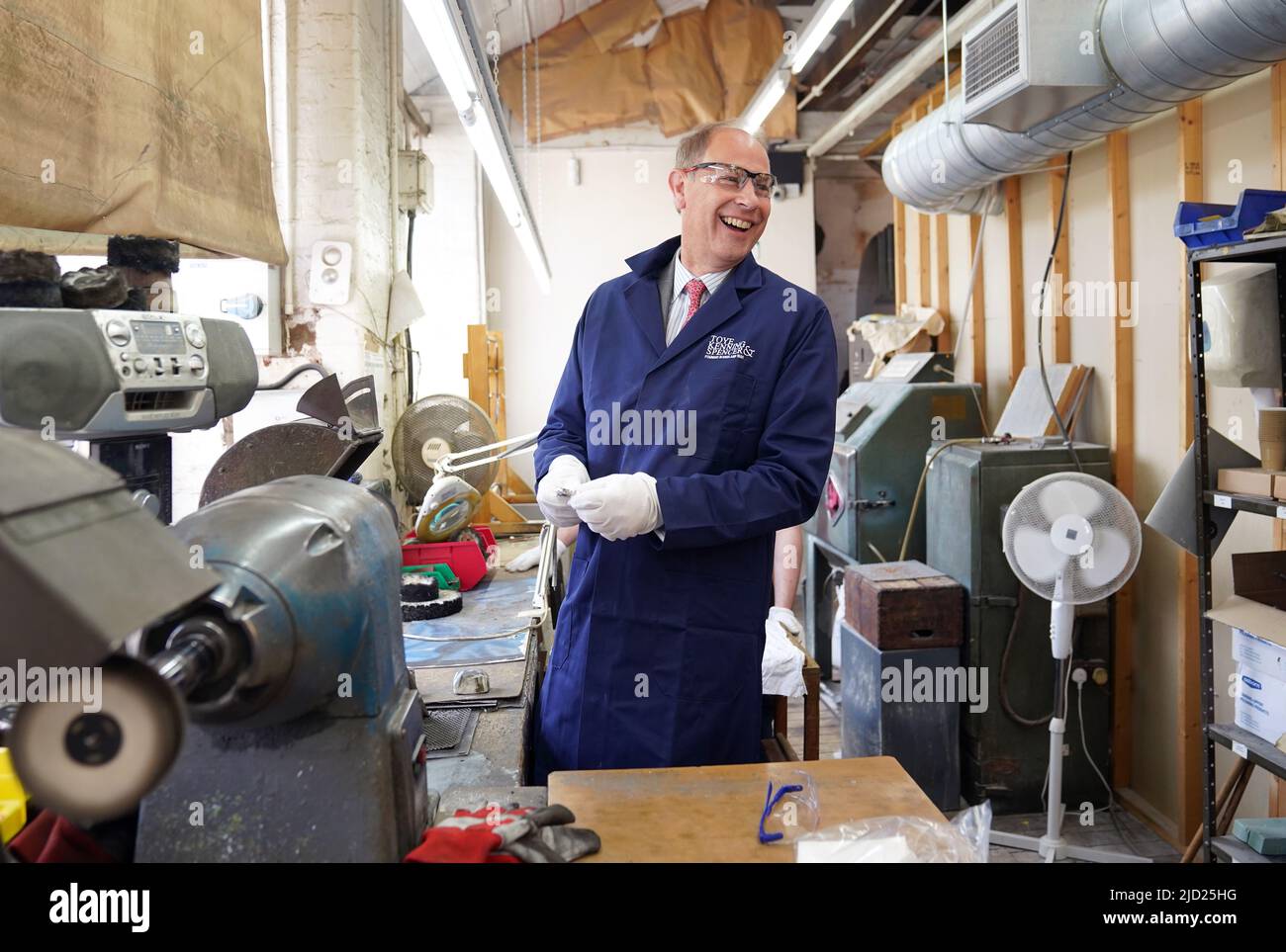 The Earl of Wessex, polishing a Commonwealth games medals during a ...