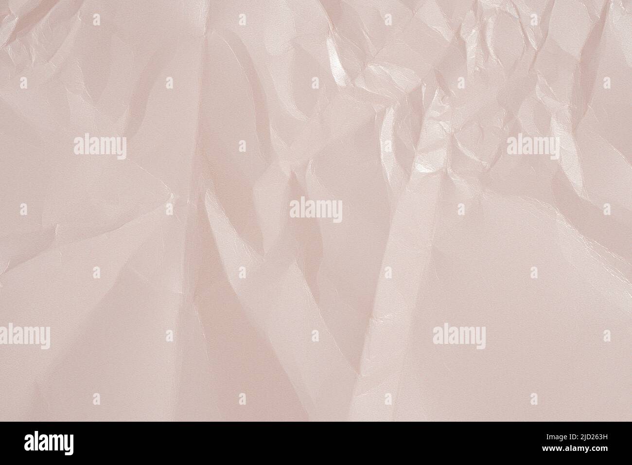 empty wrikled pink pearl tissue paper textured background. text space ...