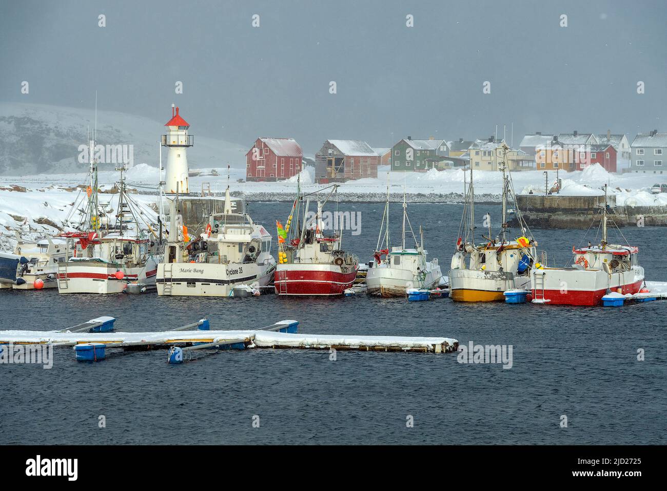 Fishing boats in Vardö Harbor, Finnmark, Norway in March Stock Photo ...
