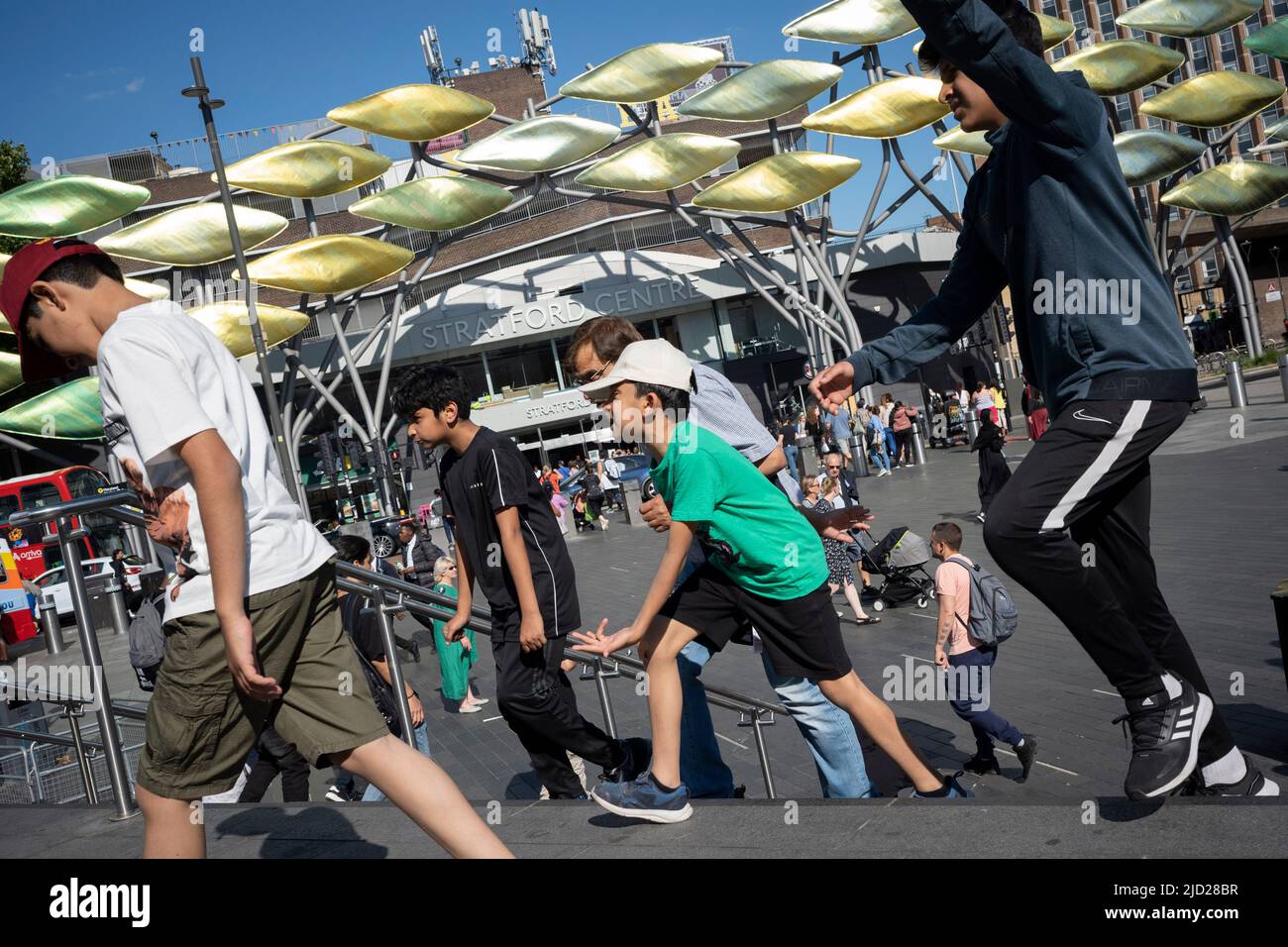 Members of the public walk up steps in Stratford, East London, on 14th ...
