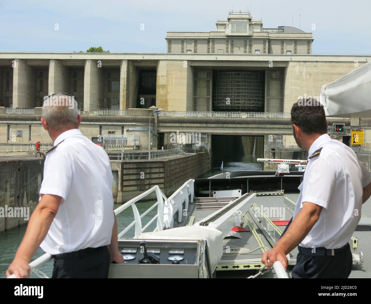 The ship's crew carefully steer the MS Van Gogh into the chamber of one ...