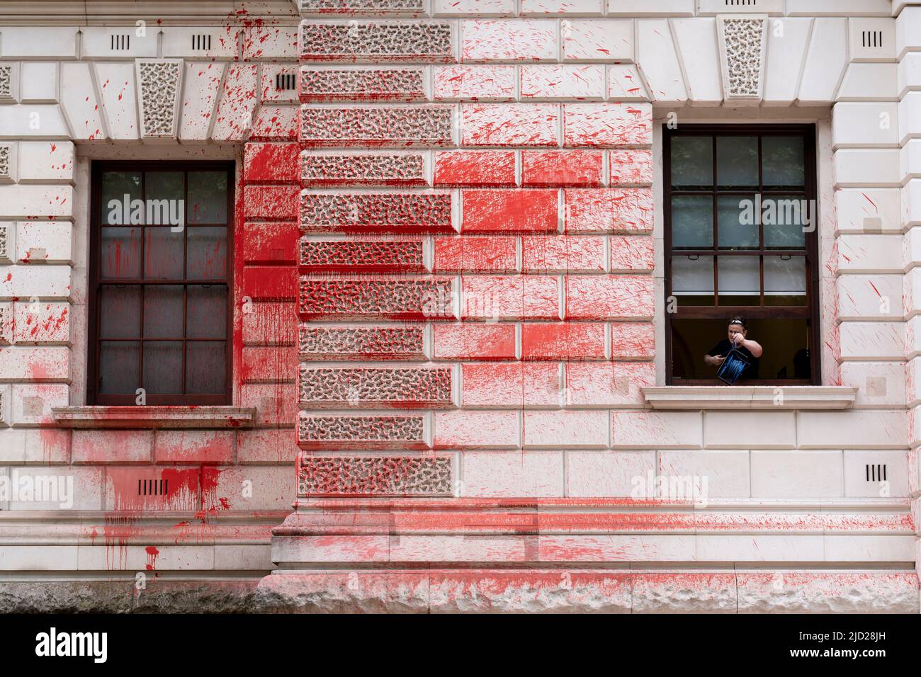 The aftermath of a red paint protest by climate change activists with ...
