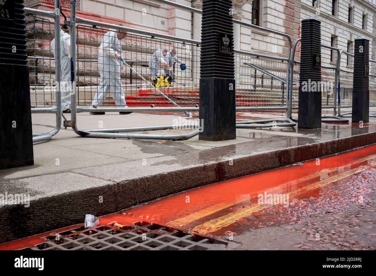 The aftermath of a red paint protest by climate change activists with ...