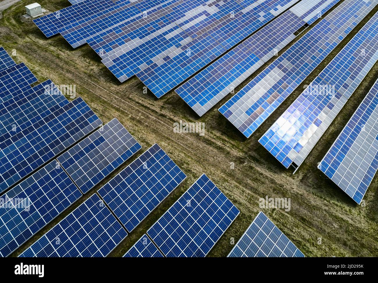 solar panel field at work with sun reflection Stock Photo - Alamy