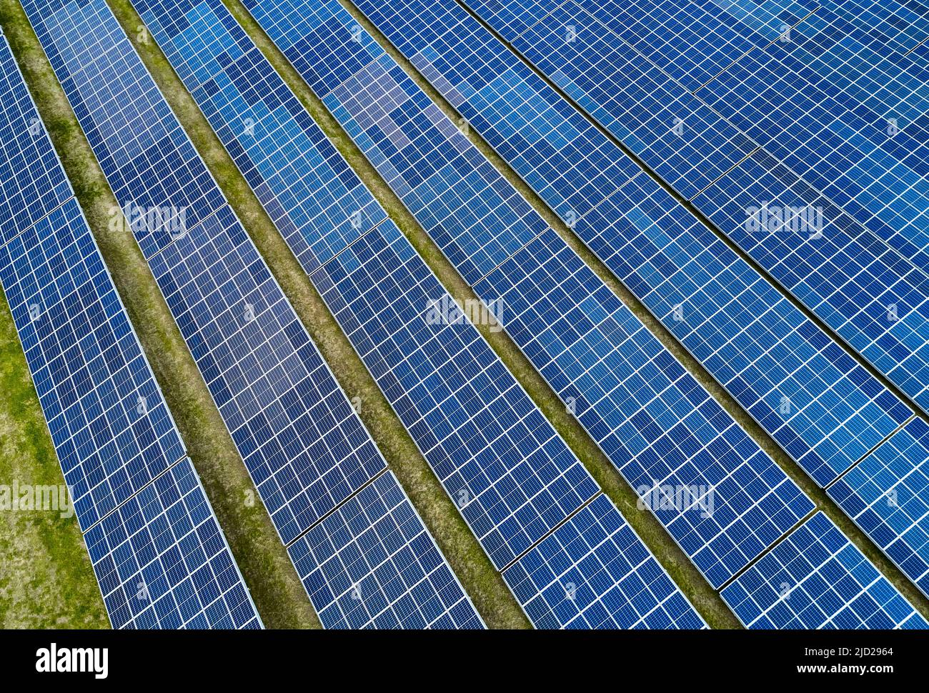 solar panel field at work with sun reflection Stock Photo - Alamy