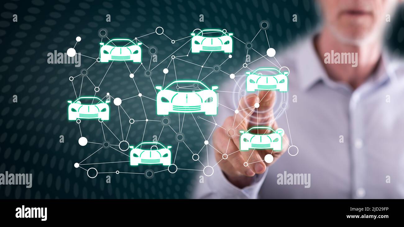 Man touching a smart car concept on a touch screen with his finger ...