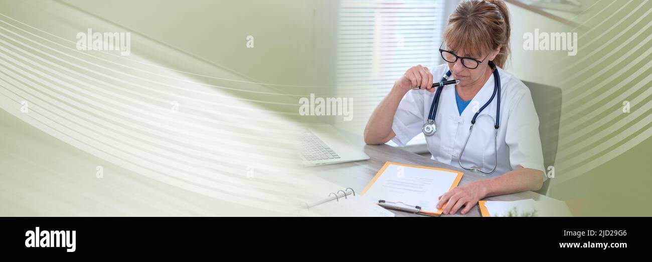 Female doctor reading a clinical record in medical office; panoramic ...