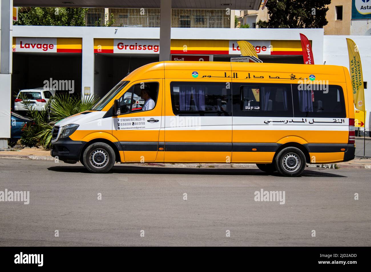 Fez, Morocco - June 16, 2022 School bus driving through the streets of ...