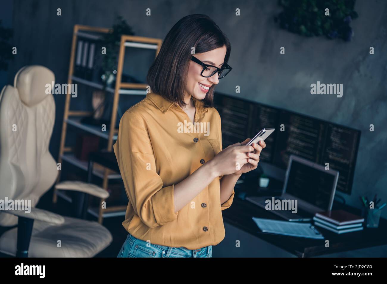 Portrait of attractive cheerful focused girl expert using device gadget ...