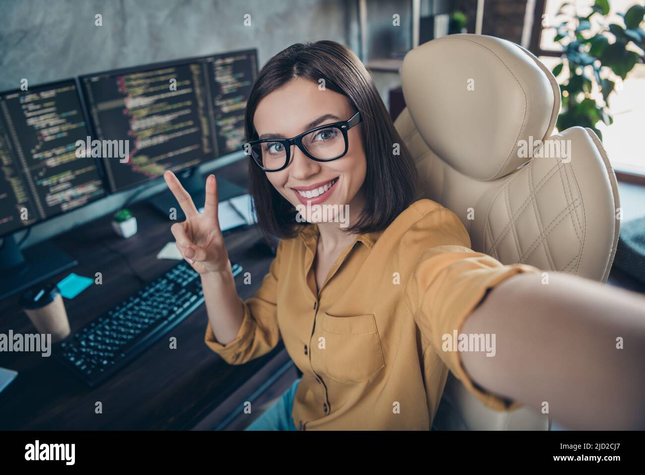 Self-portrait of beautiful cheerful skilled girl cyber editor developer ...