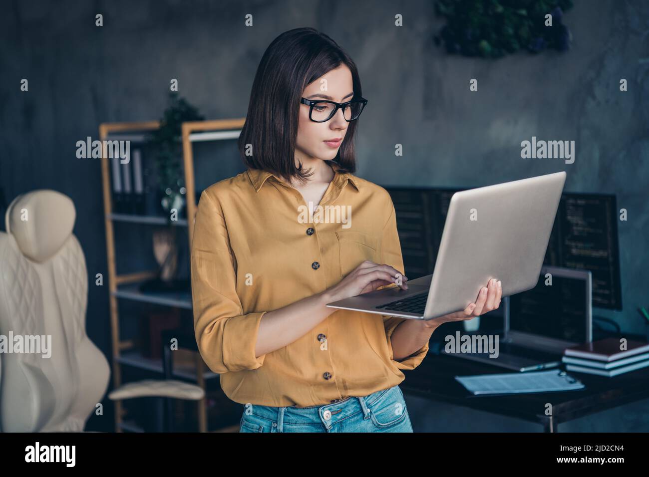 Portrait of attractive focused skilled girl expert typing email editing ...