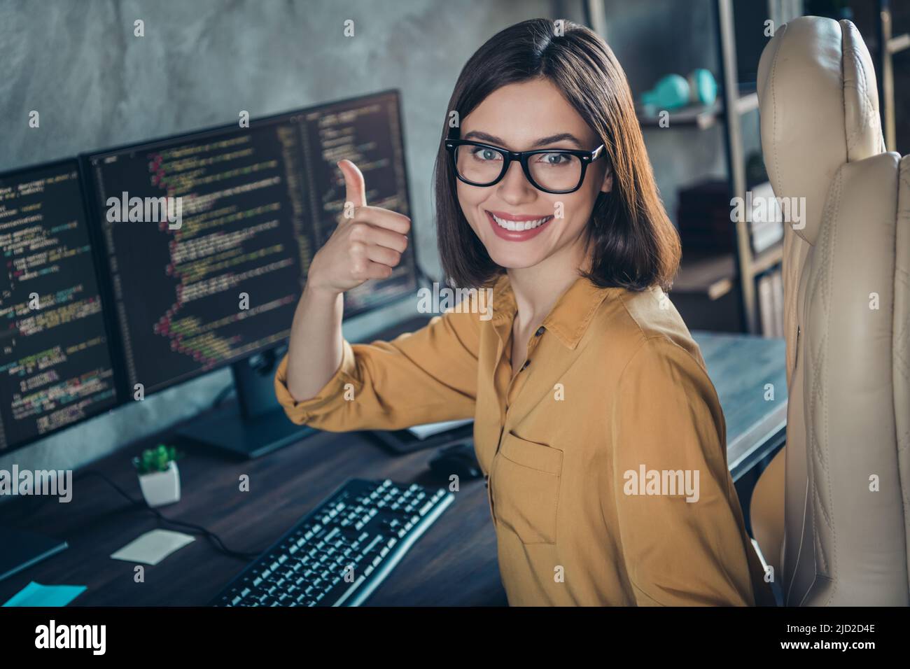 Portrait of beautiful cheerful girl web designer developing web startup ...