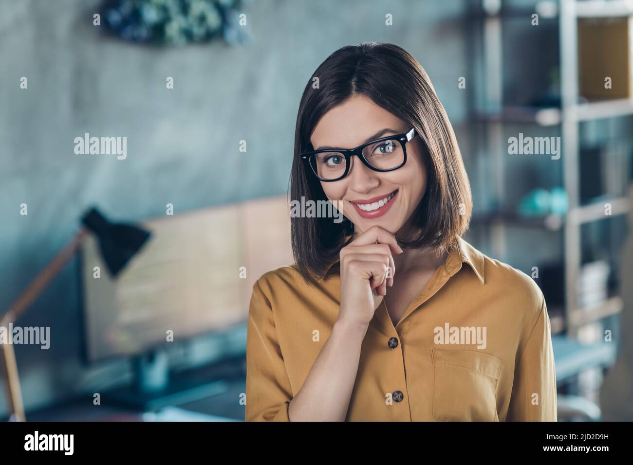 Portrait of attractive skilled cheerful girl nerd geek touching chin ...