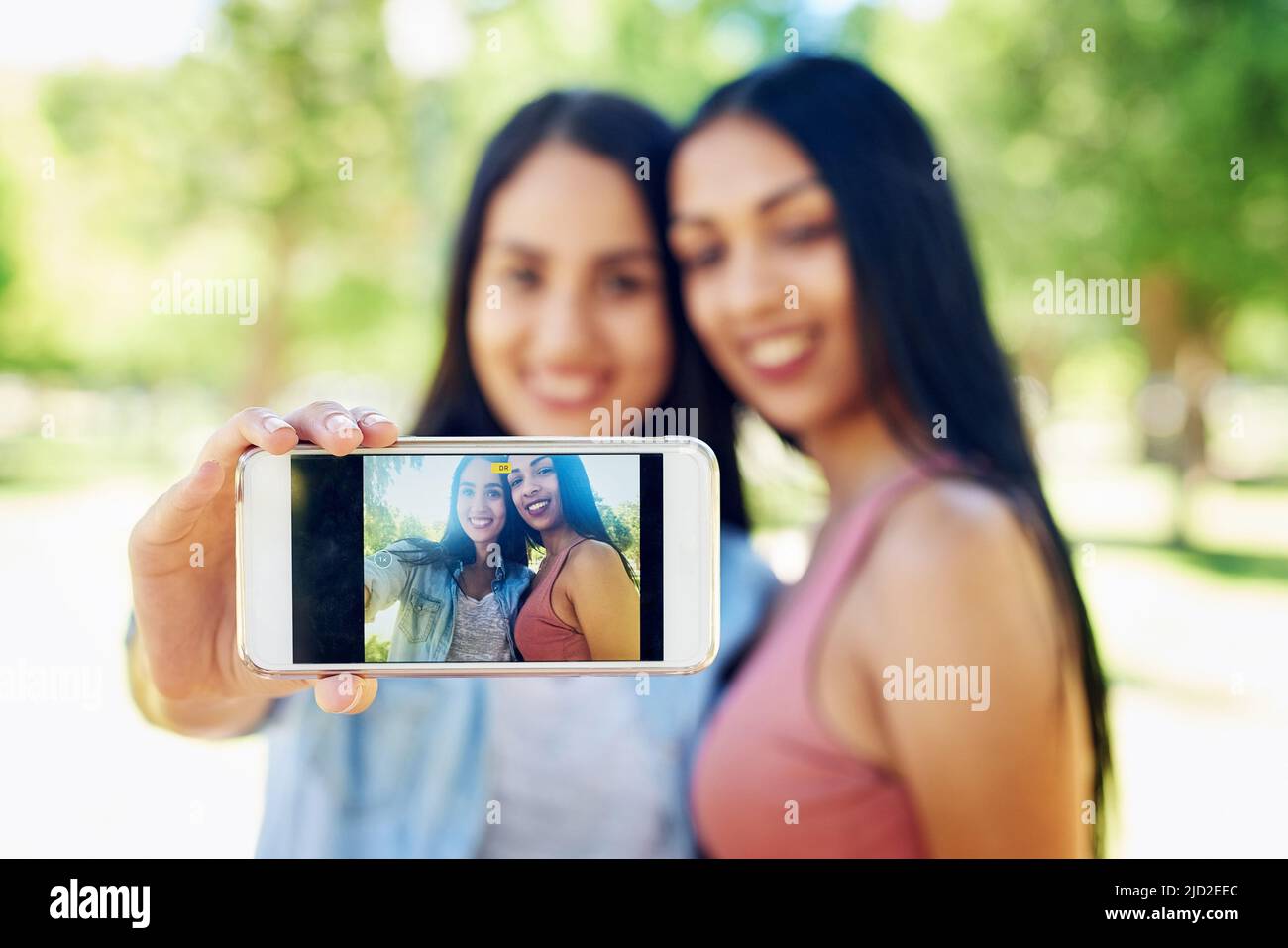 Best friends take the best selfies. Shot of two young friends taking a ...