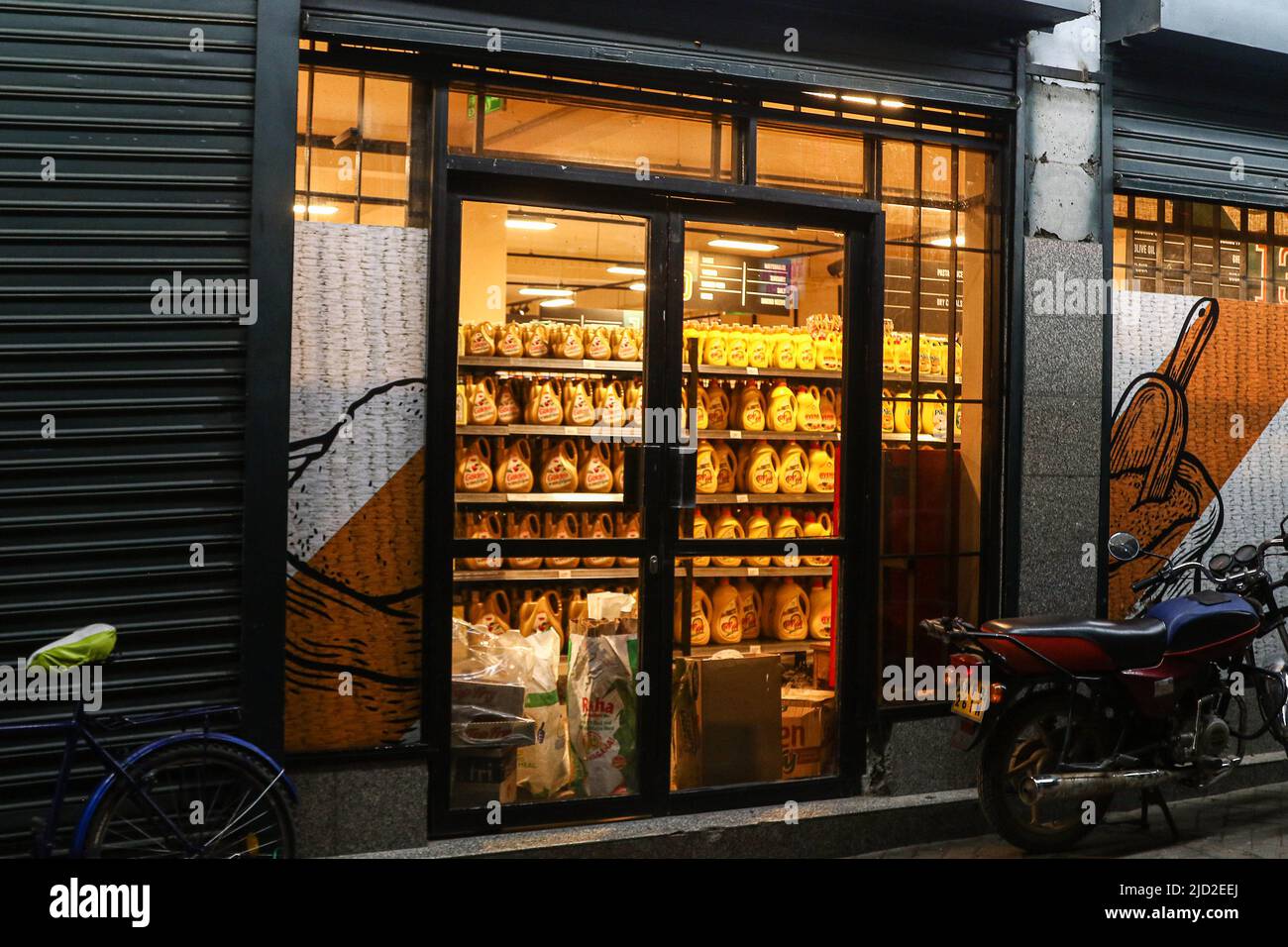 Plastic bottles of cooking oil are seen displayed on shelves at a ...
