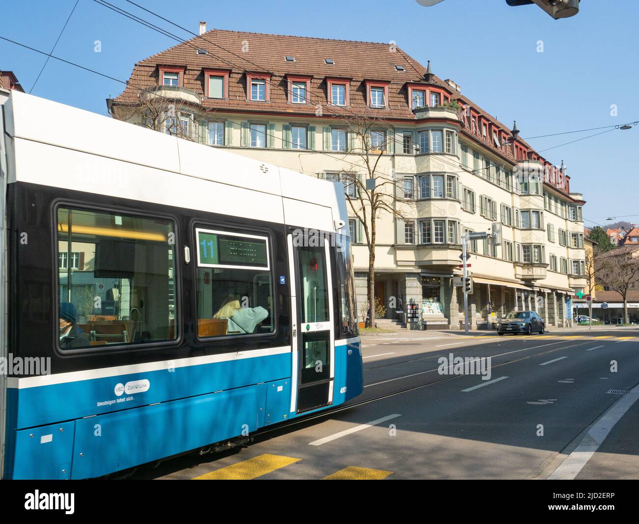 Zurich, Switzerland - March 26th 2022: A modern tram passing historic ...