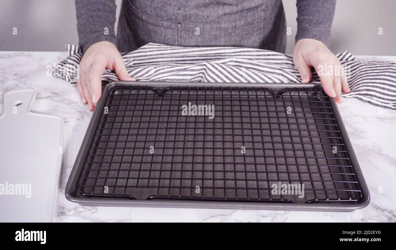 Step by step. Empty cookie tray with drying rack on a marble kitchen ...