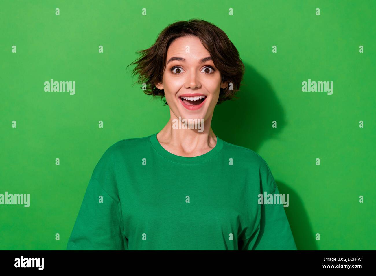 Photo of sweet impressed woman wear casual t-shirt smiling open mouth ...