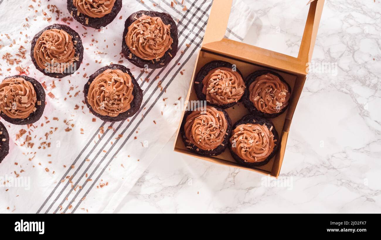 Flat lay. Step by step. Packaging chocolate cupcakes with chocolate ...
