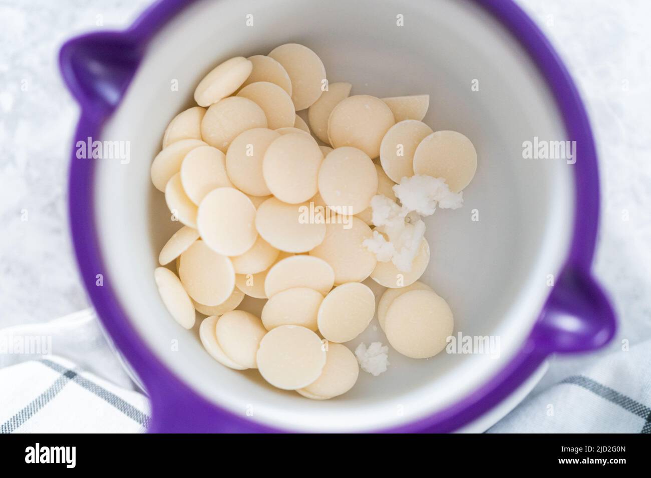 Melting color chocolate chips in electric candy melting pot Stock Photo ...