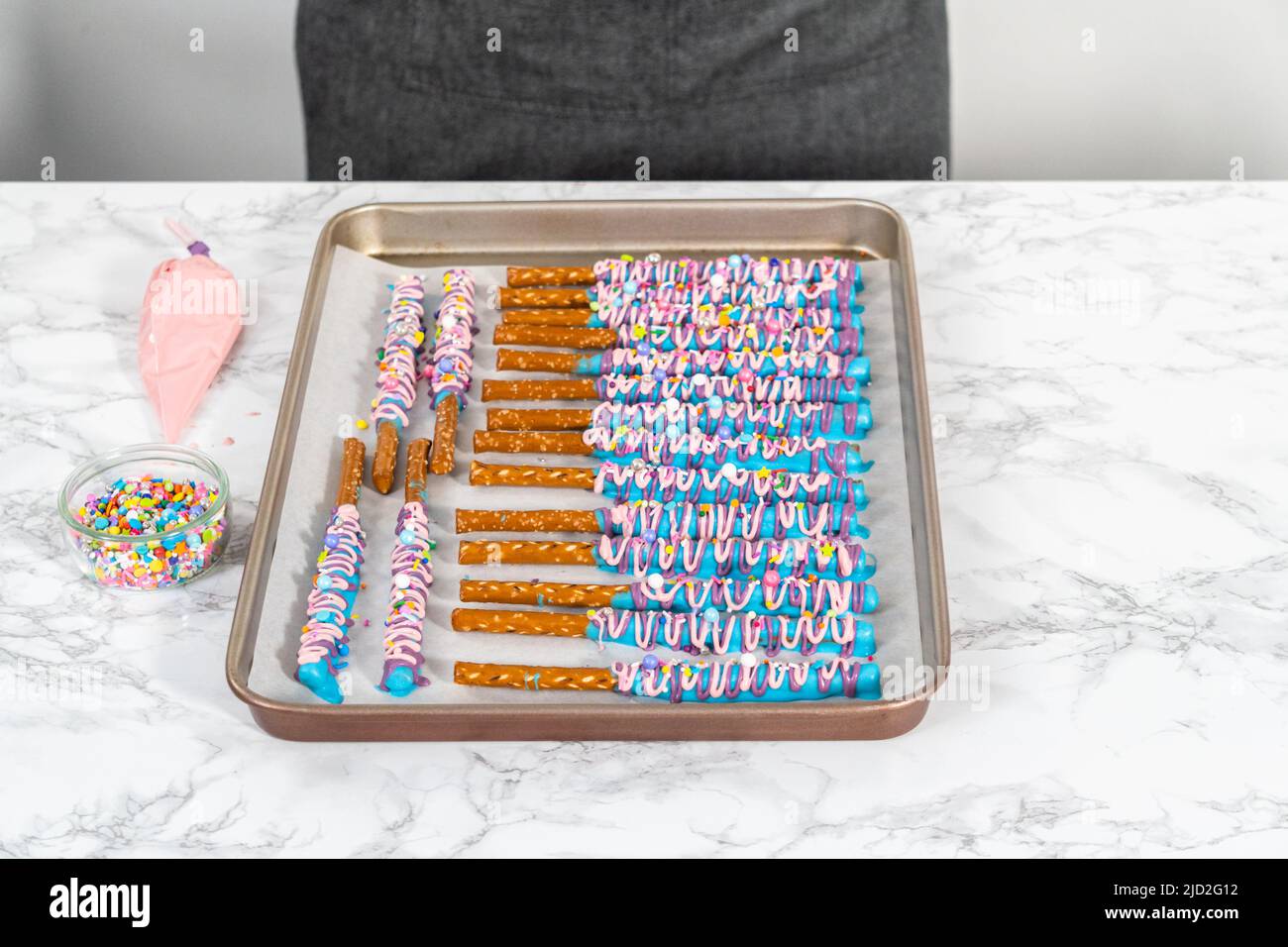 Mermaid chocolate pretzel rods drizzled with pink and purple chocolate ...