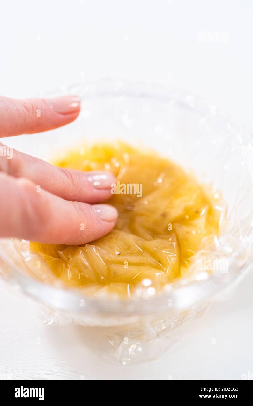 Mashed overripe banana in a glass mixing bowl Stock Photo - Alamy