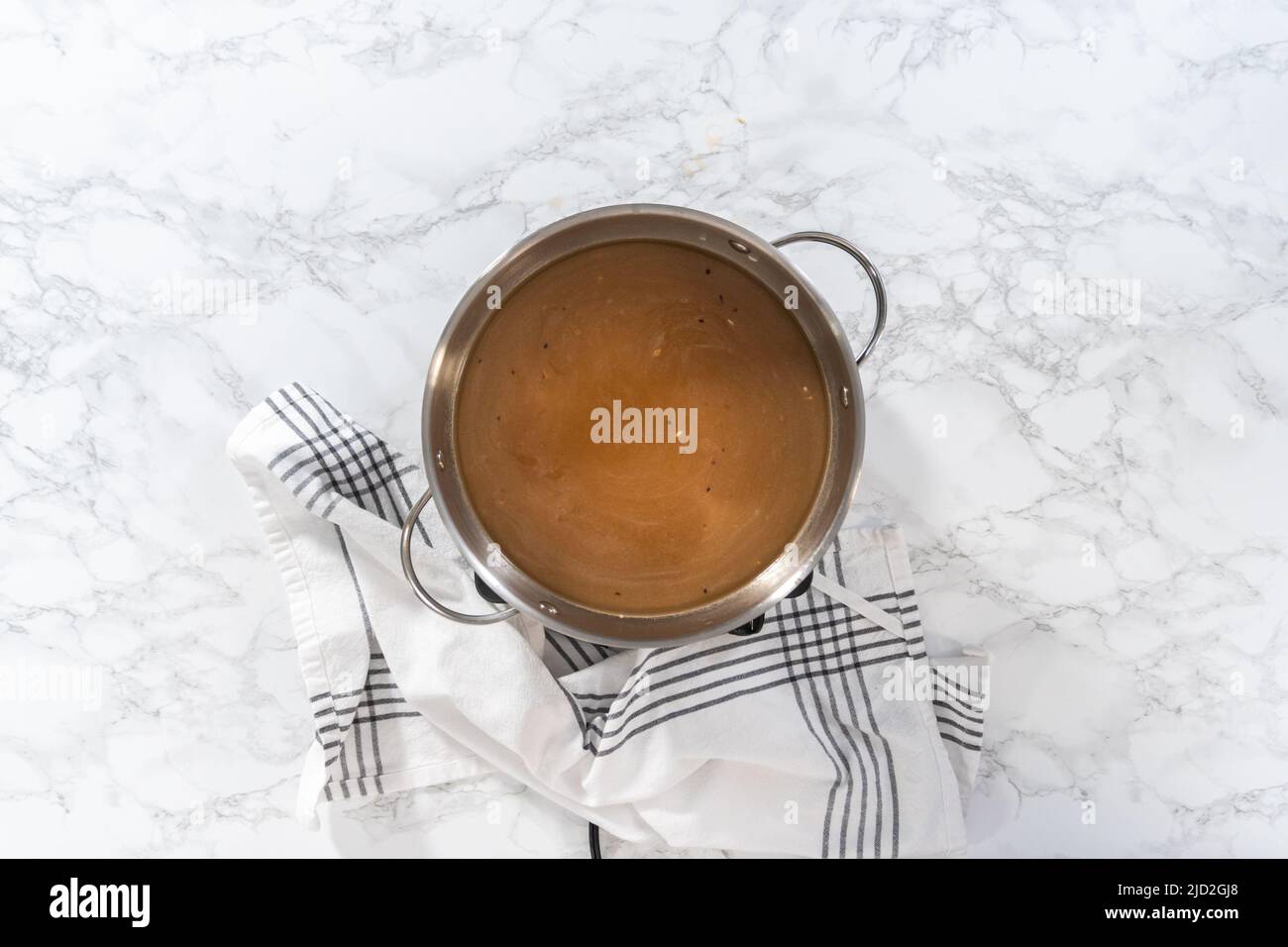 Flat lay. Cooking Mexican rice in a stainless steel cooking pot Stock ...