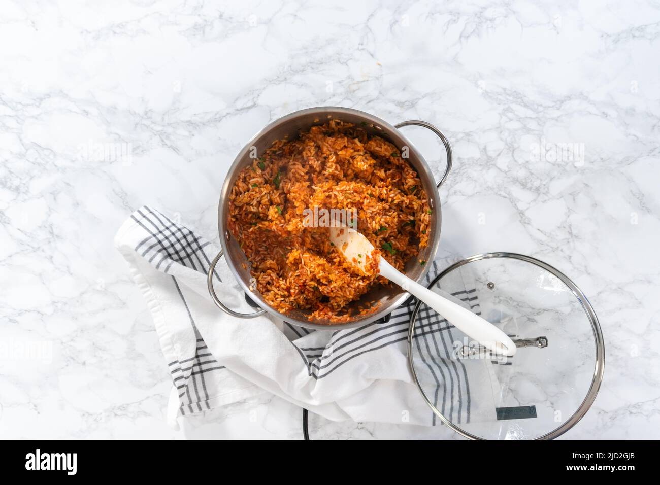 Flat lay. Cooking Mexican rice in a stainless steel cooking pot Stock ...