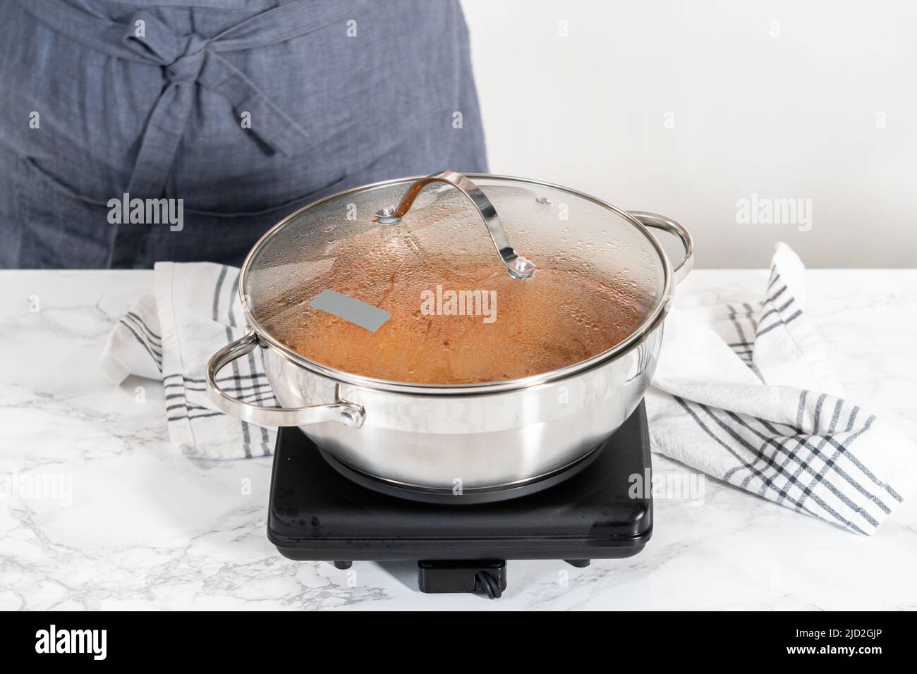 Cooking Mexican rice in a stainless steel cooking pot Stock Photo - Alamy