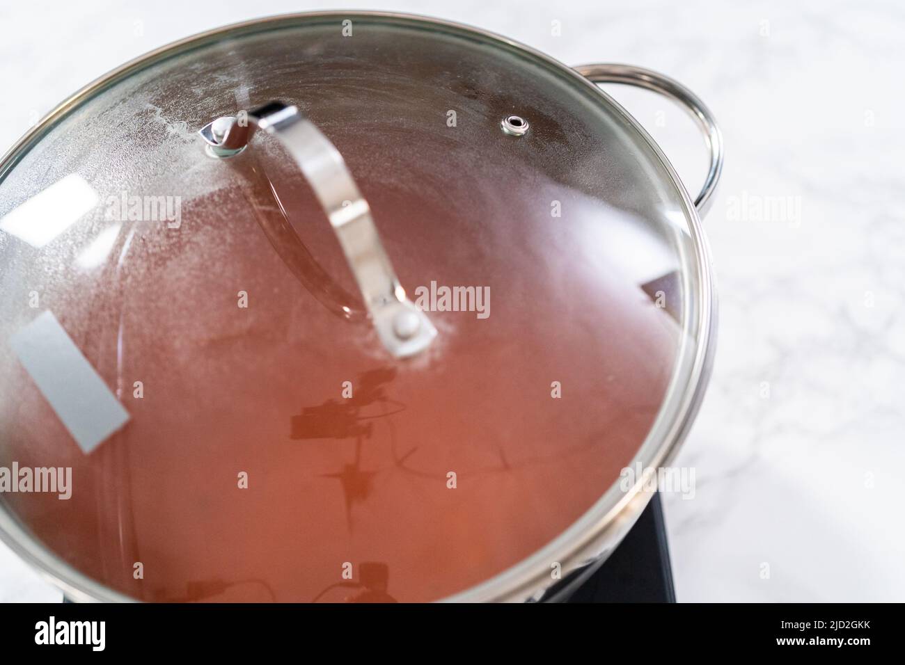 Cooking Mexican rice in a stainless steel cooking pot Stock Photo - Alamy