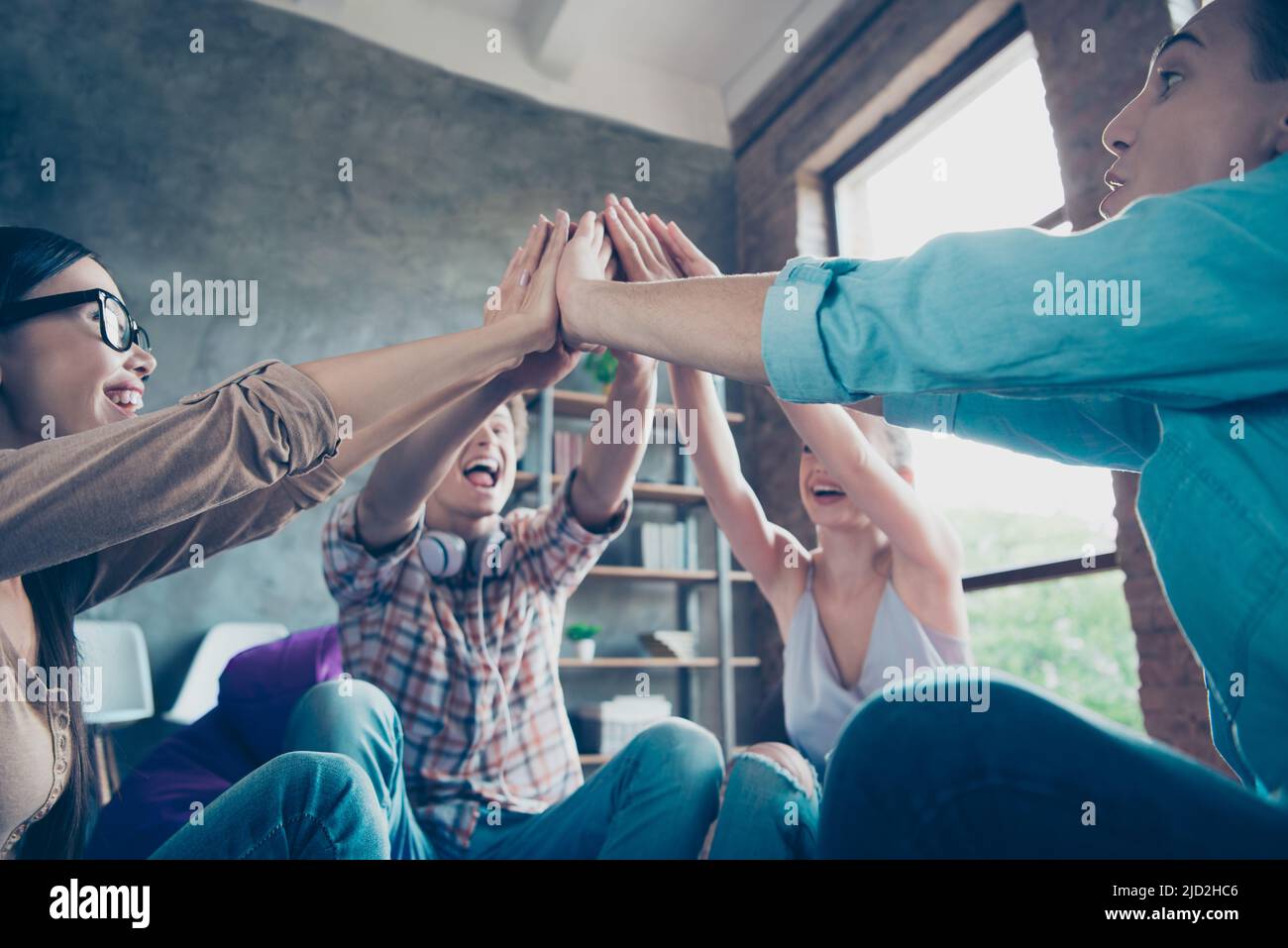 Cropped portrait of four delighted intelligent people hands palms give ...