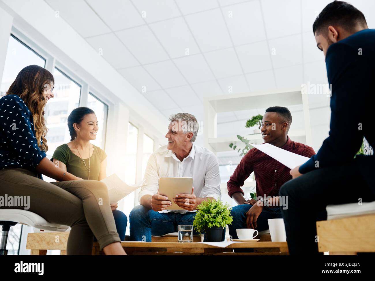 Creativity is best done in a group. Shot of creative employees working ...